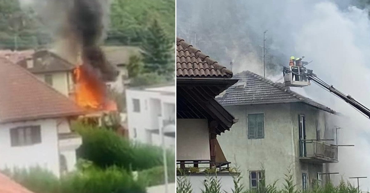 Incendio in un'abitazione, grossa colonna di fumo e le fiamme escono ...